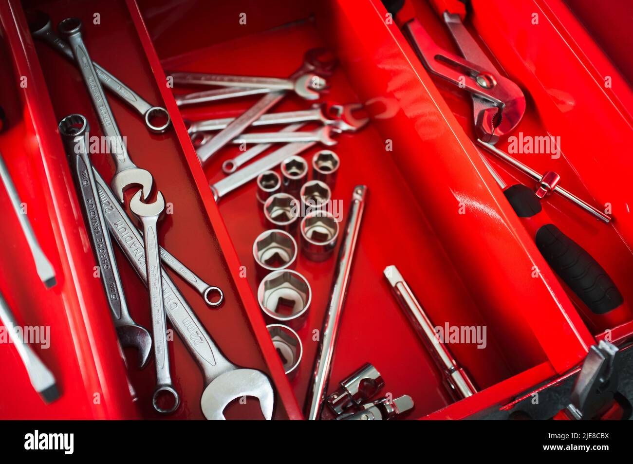 Repairman red toolbox with wrench kit Stock Photo - Alamy