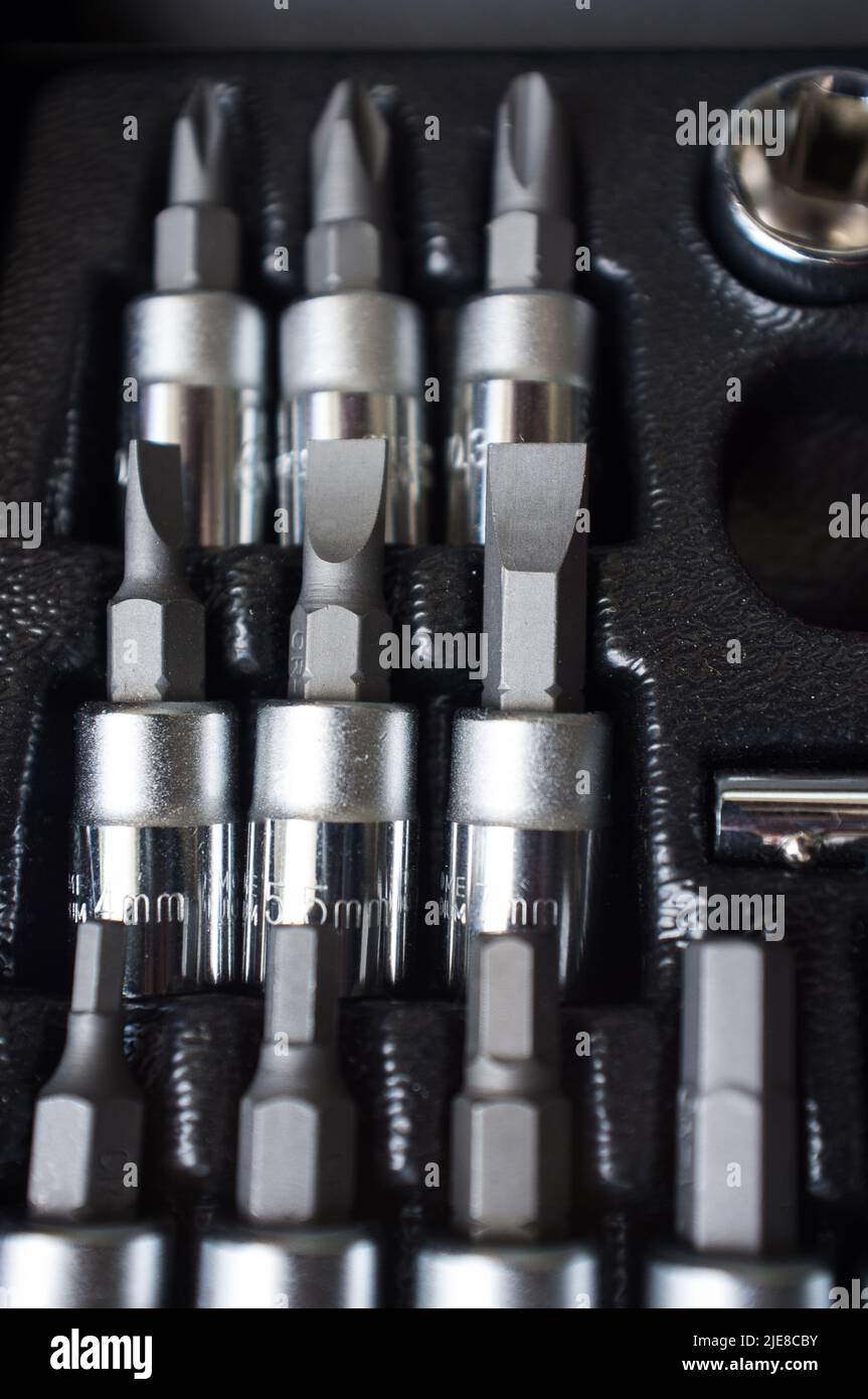 Set of screwdriver bits on toolbox Stock Photo - Alamy