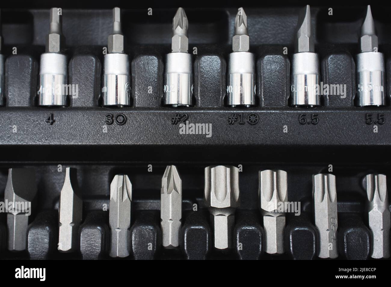 Set of screwdriver bits on toolbox Stock Photo - Alamy