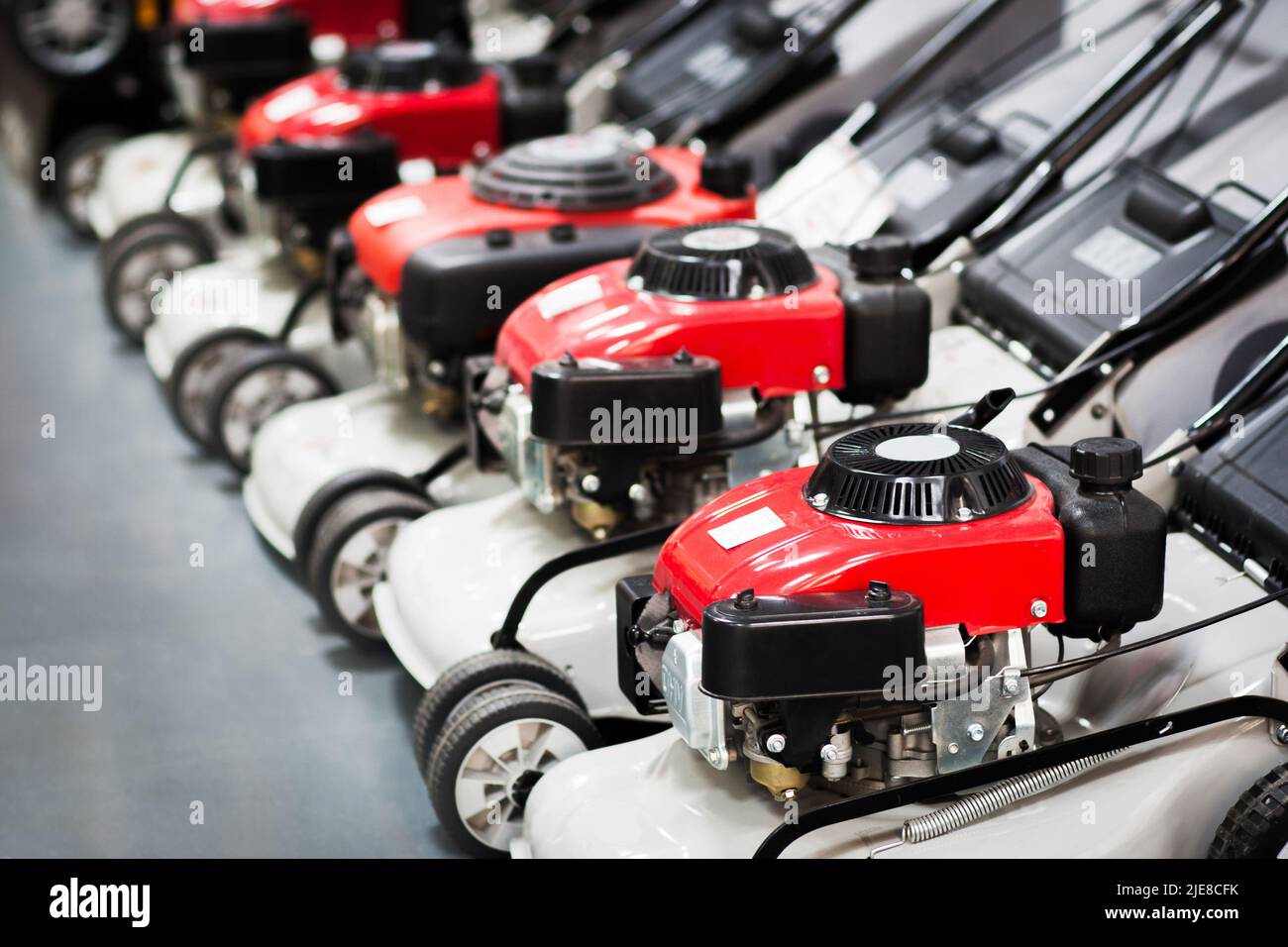 Showcase of the lawn mower in store Stock Photo - Alamy