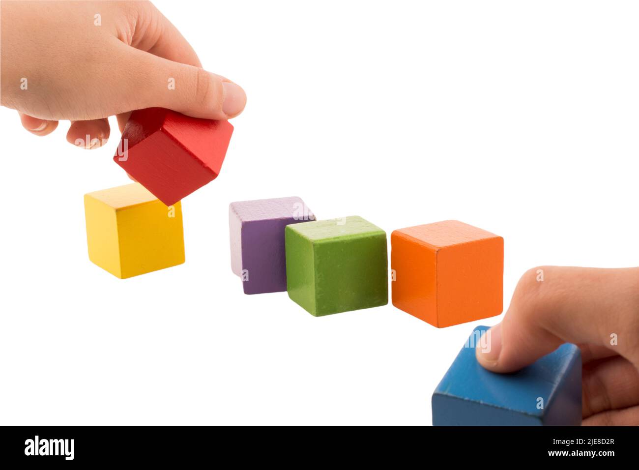 Hands playing and building with colorful wooden toy blocks. Early ...