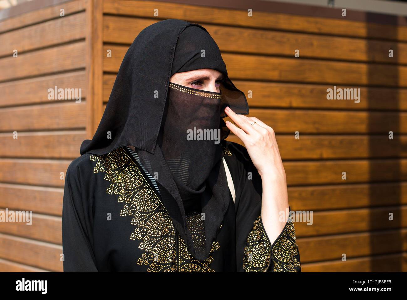 Muslim woman carefully looks into the distance bright sunny day Stock ...