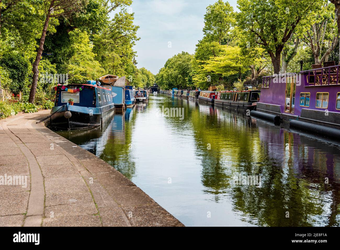 Colorful typical narrowboats moored along Little Venice basin, near the ...