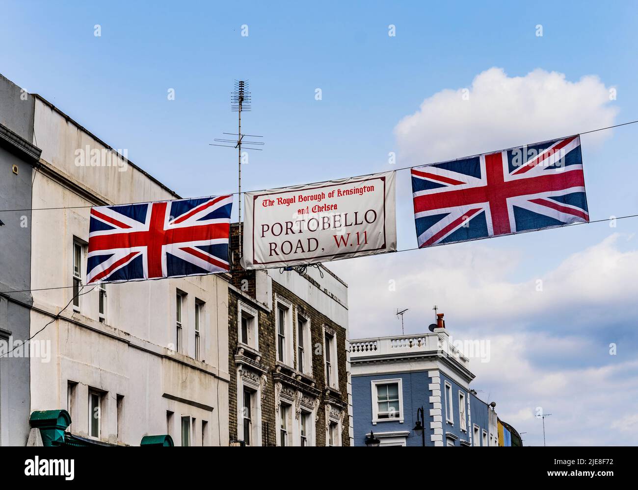 Hanging street sign pointing the beginning of "Portobello Road" with ...