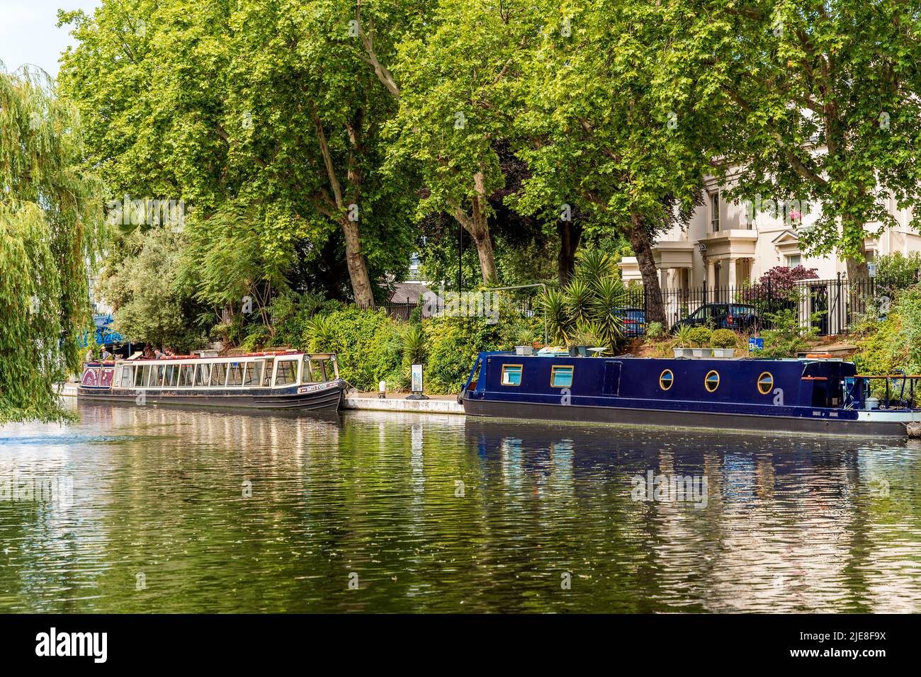 Colorful typical narrowboats moored along Little Venice basin, on the ...