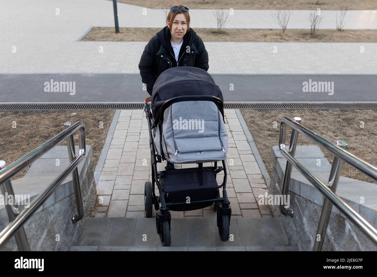 Parent with stroller stairs hi-res stock photography and images - Alamy