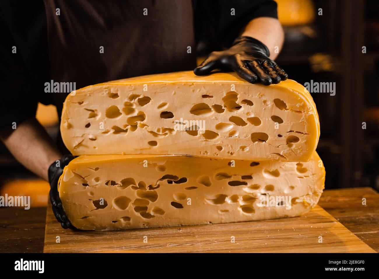2 half of yellow cheese wheel limited maasdam natural aged. Cutting ...