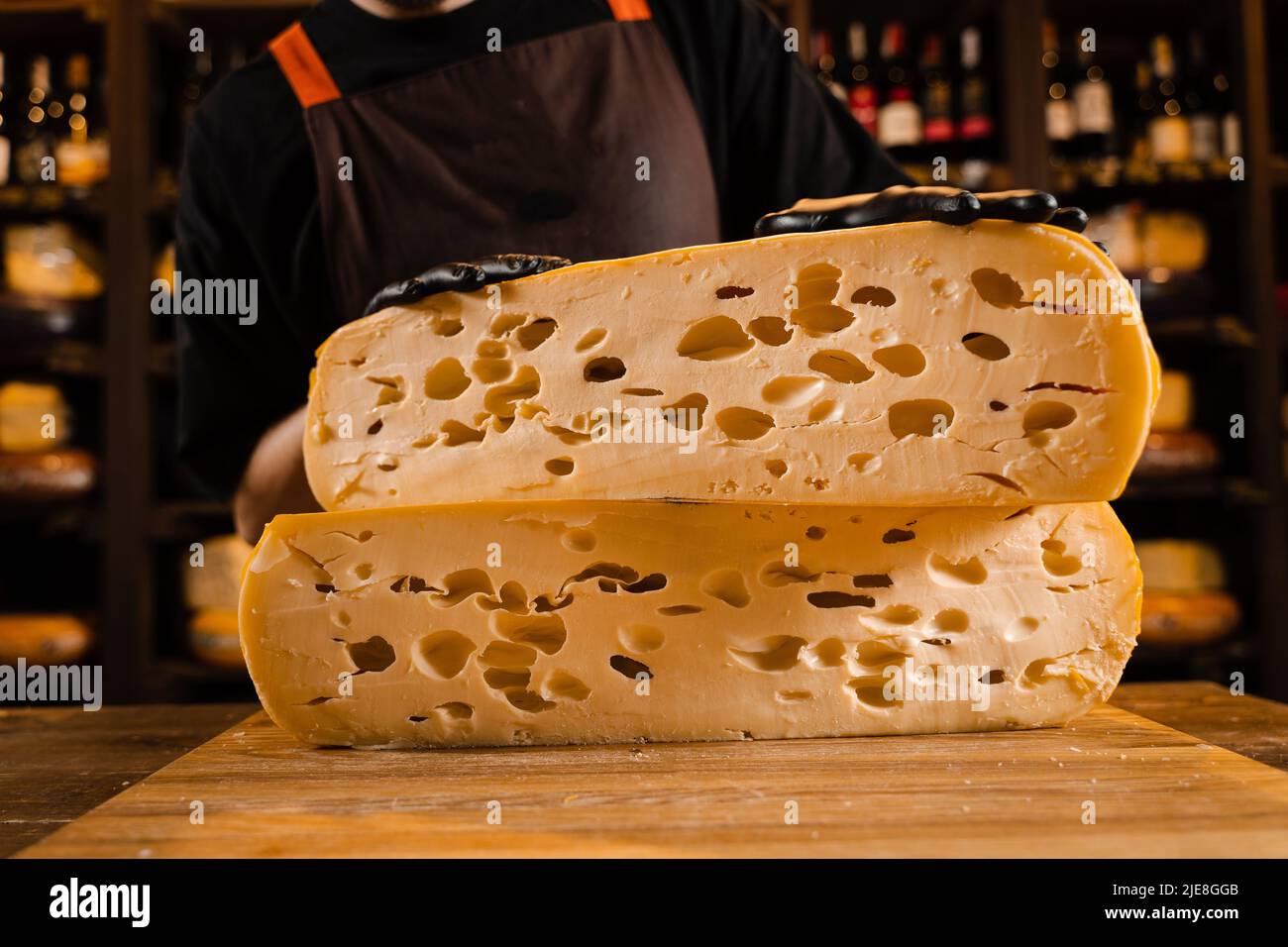 2 half of yellow cheese wheel limited maasdam natural aged. Cutting ...