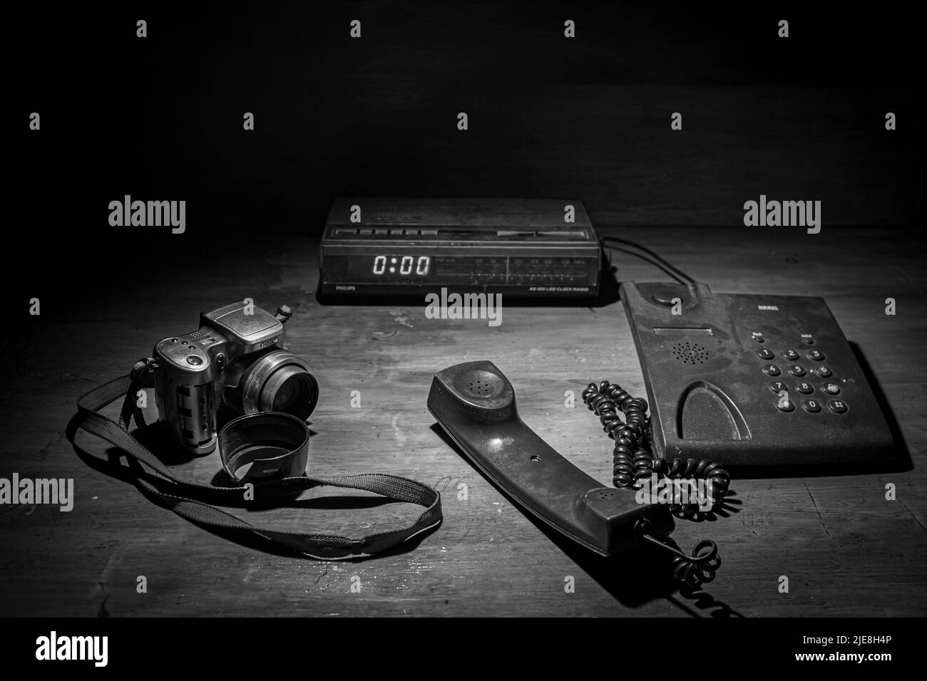 Vintage Camera, Radio, and Phone put in an old wooden desk. Black ...