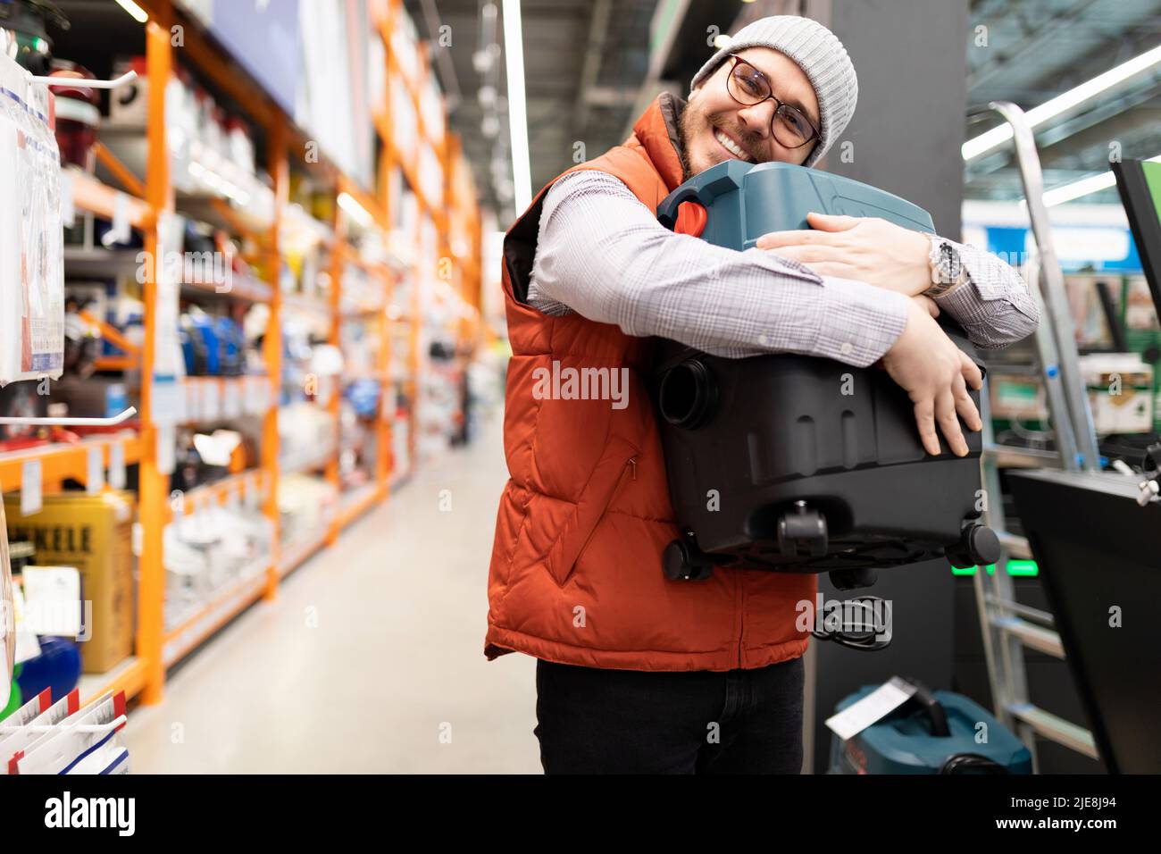 a man bought a construction vacuum cleaner for his house Stock Photo ...