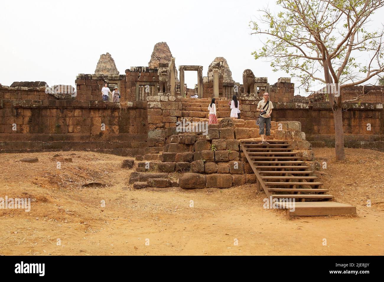 Tourists are visiting the East Mebon temple ruins, Angkor, Siem Reap ...
