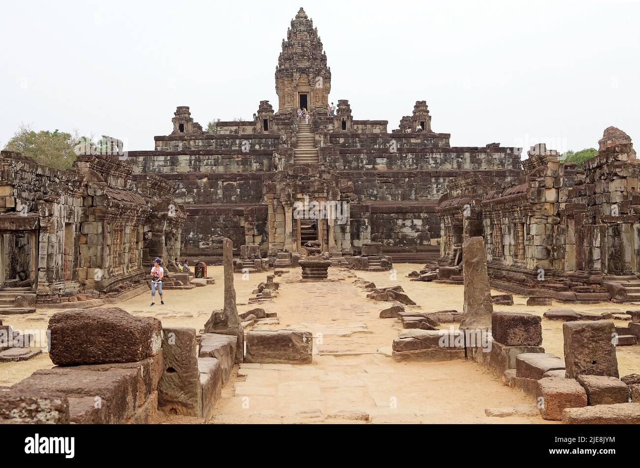 Tourists are visiting the Bakong temple ruins, Angkor, Siem Reap, Cambodia. The temple is part ...