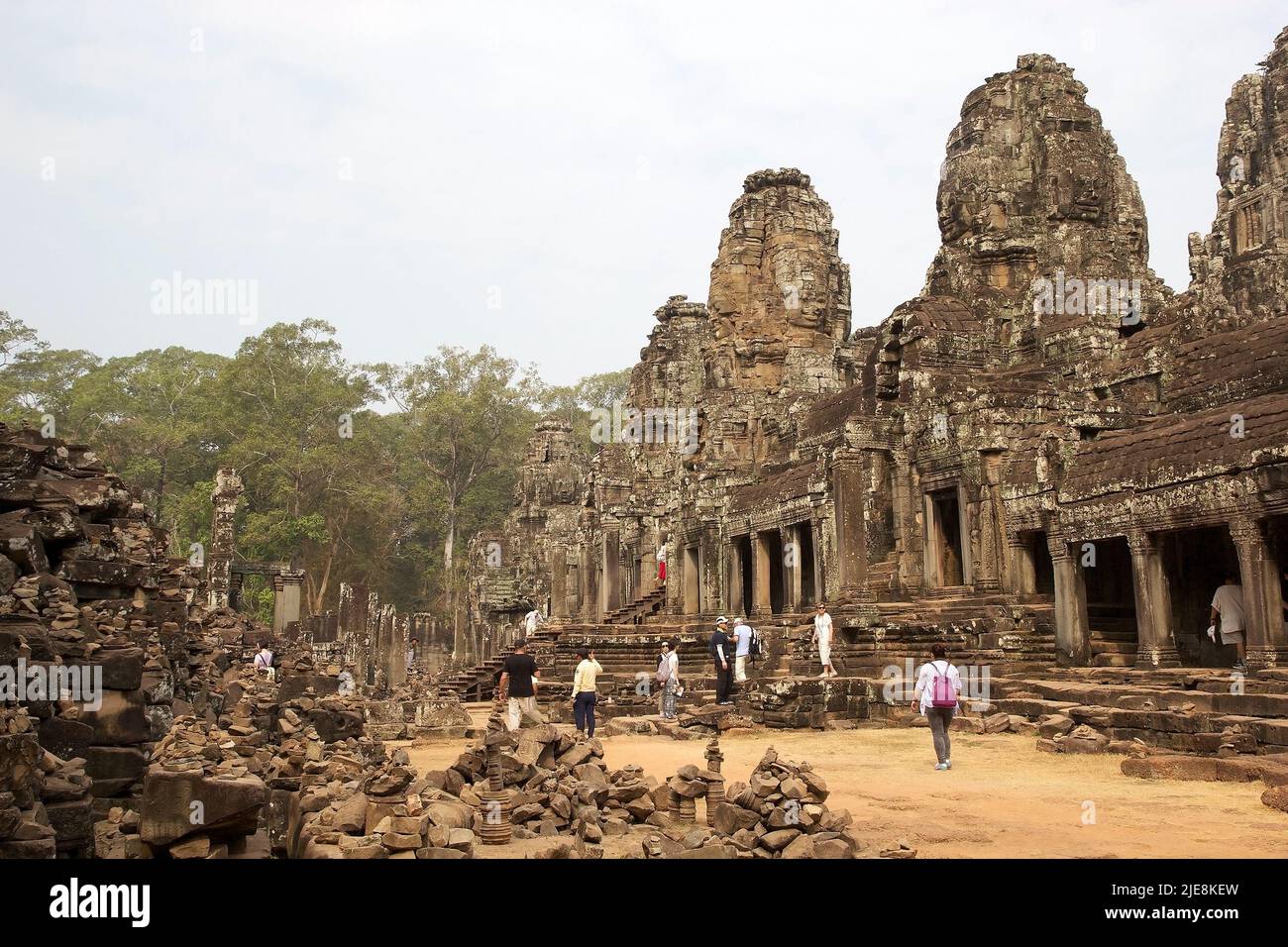 Tourists are visiting the Bayon temple where there are the smiling ...