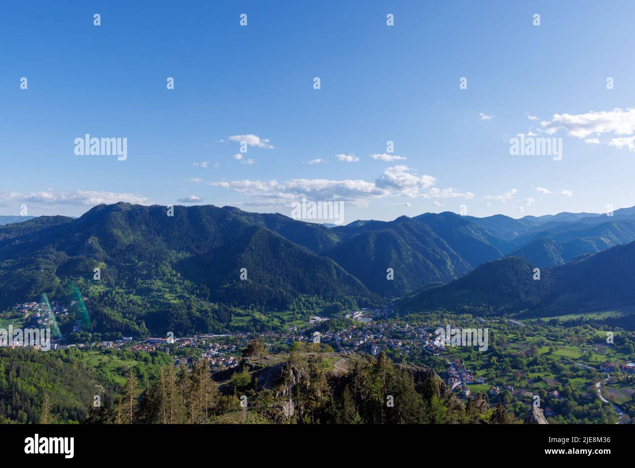 View from high rock to old village town of Smolyan with green meadows ...