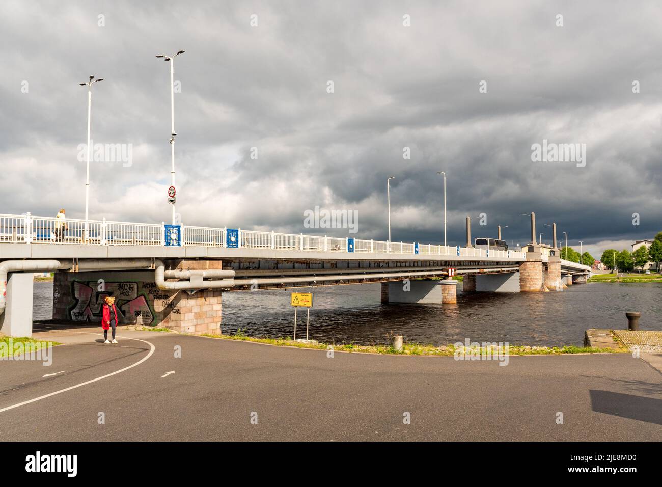 Parnu kesklinna white old bridge on the Parnu river with cloudy sky on ...