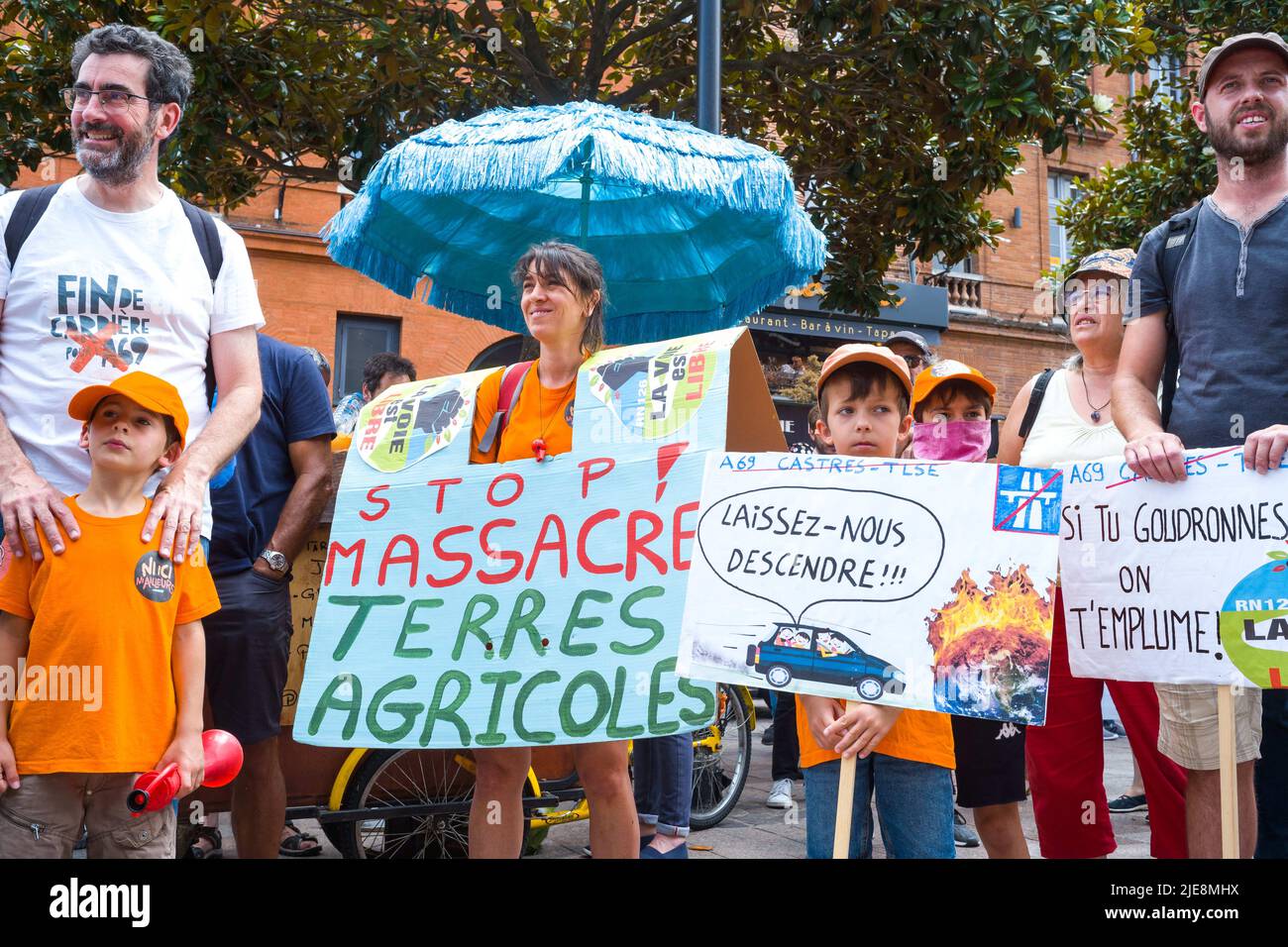 A family with signs, Stop! Massacre Agricultural Land. Regional ...