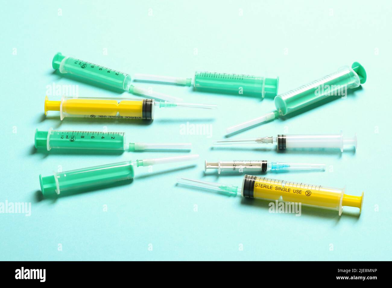Top view of different syringes at blue background. Medical injection ...