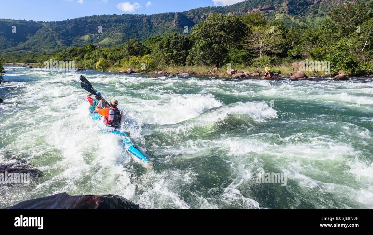 Canoe race action thrills challenge through water rapids for paddlers ...