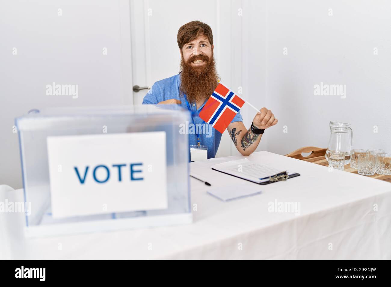 Caucasian man with long beard at political campaign election holding ...