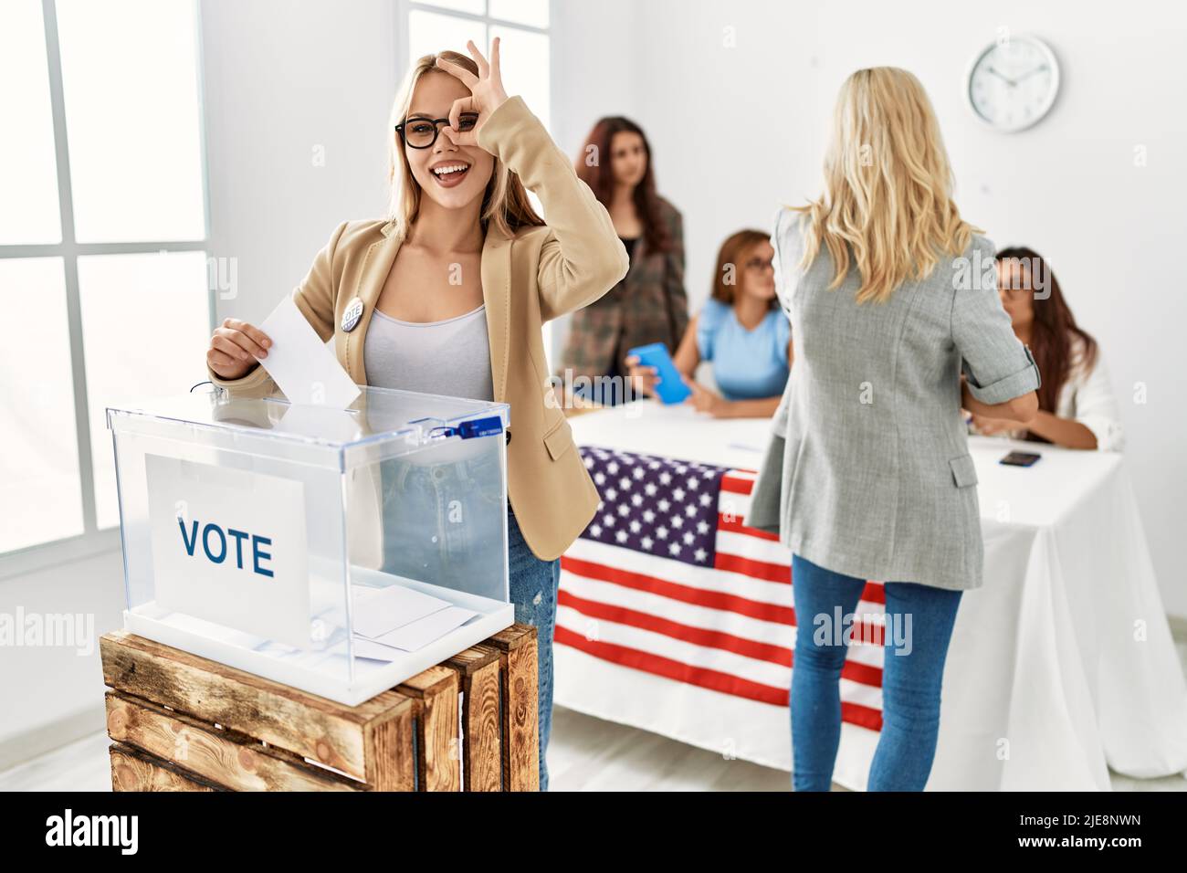 Group of young girls voting at democracy referendum doing ok gesture ...