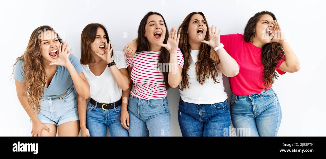 Group of women wearing casual clothes standing over isolated background ...