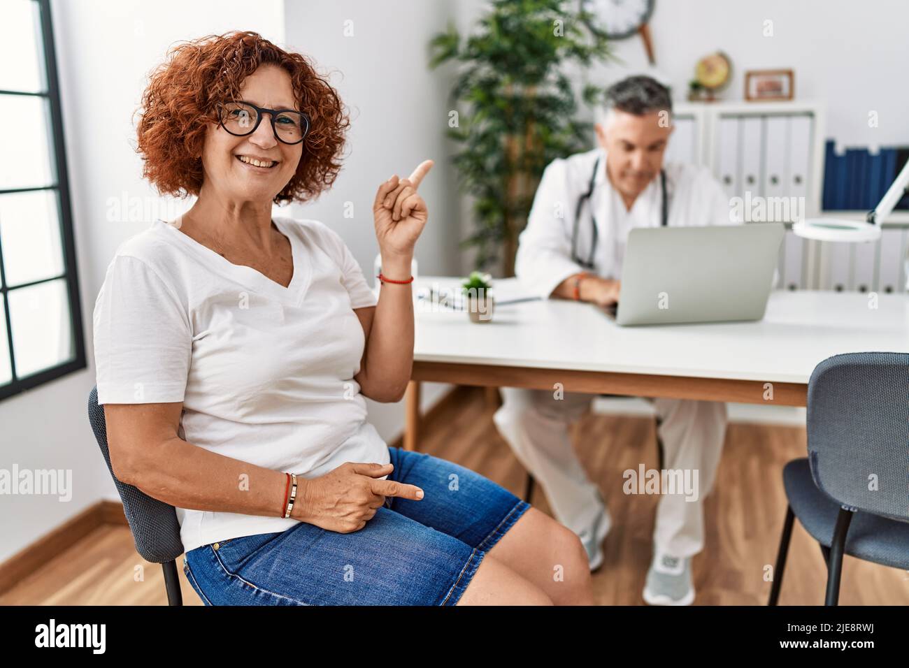 Senior woman sitting at doctor appointment with a big smile on face ...