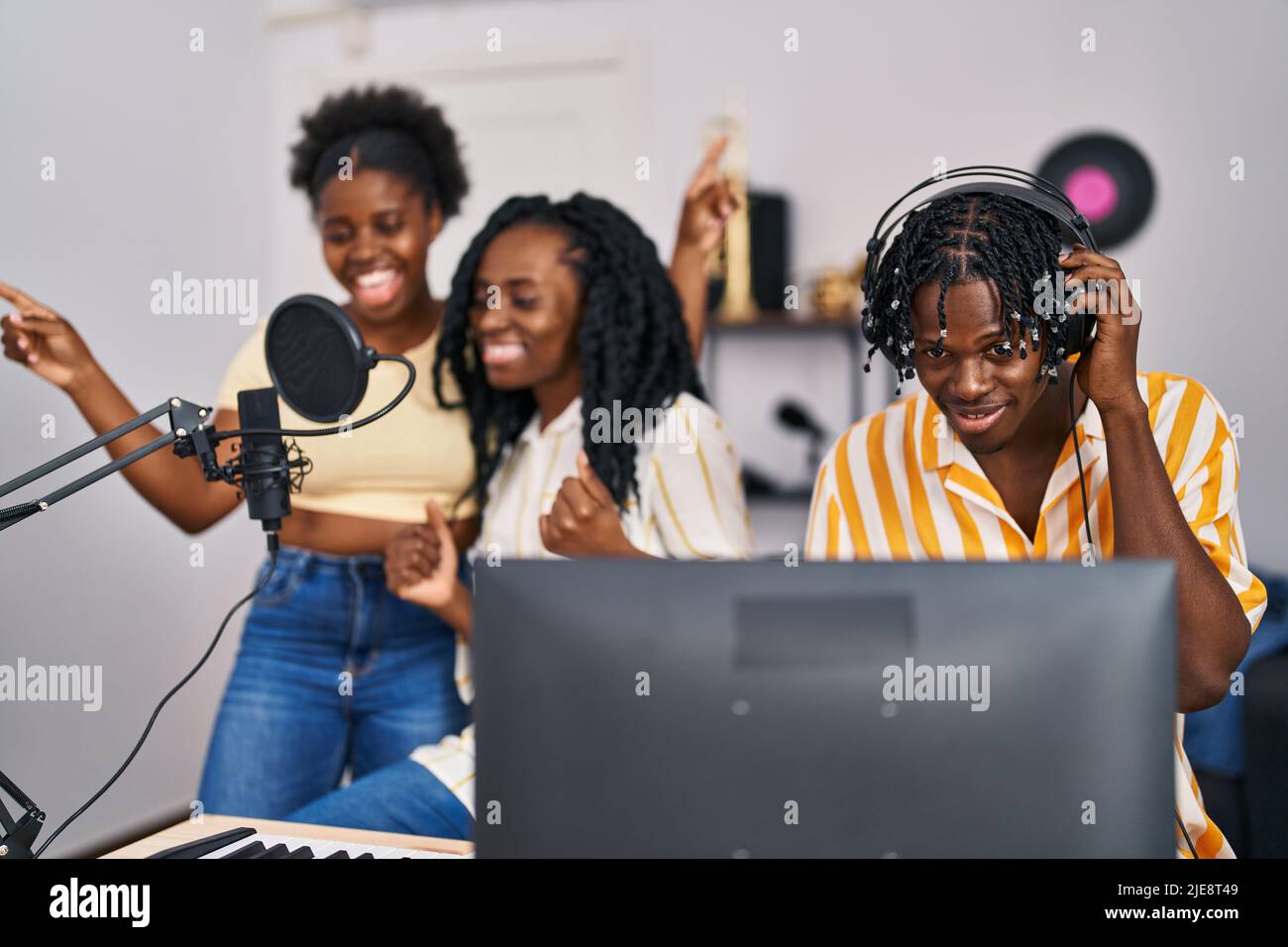 African american friends musicians group singing song at music studio ...