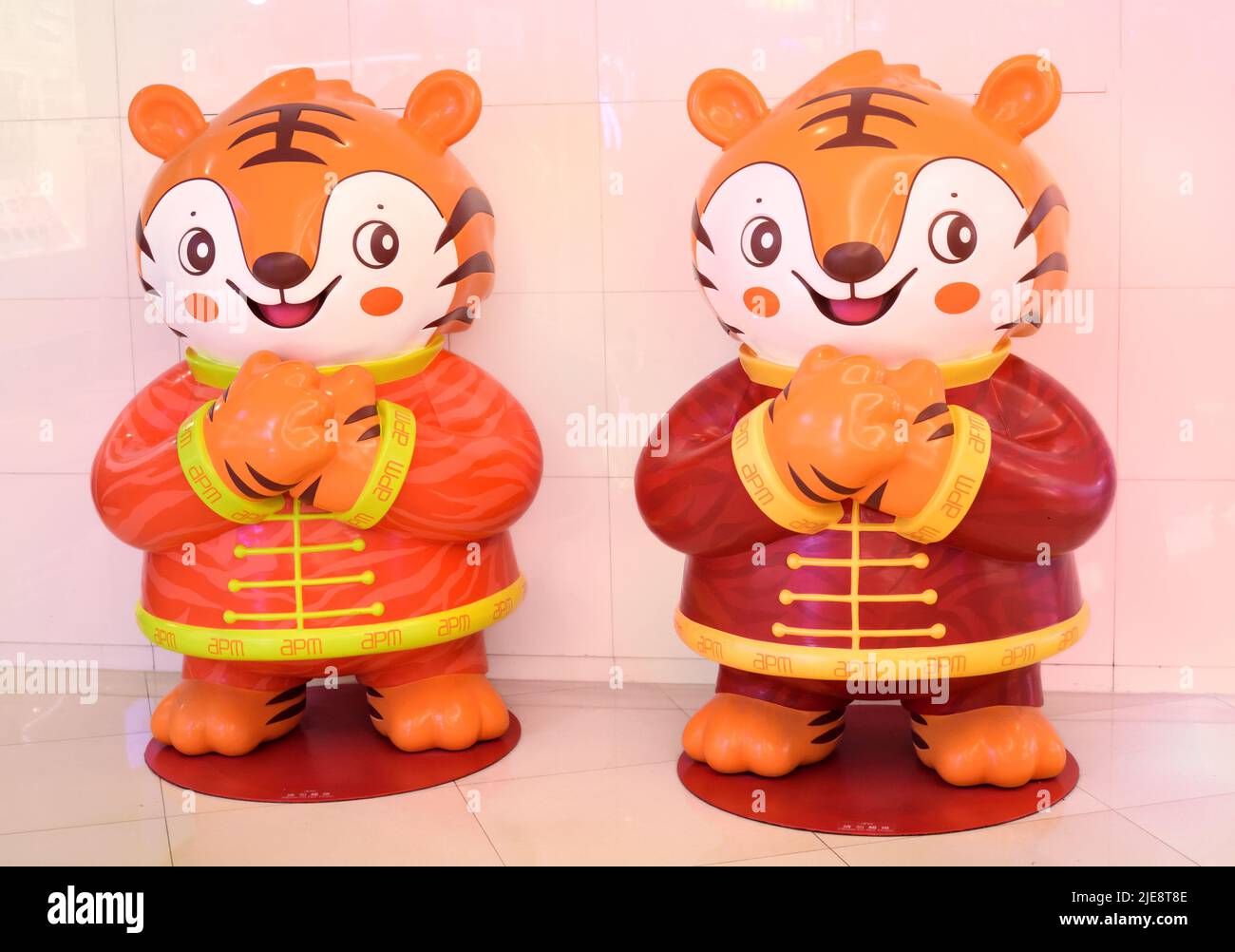 Twin tigers show Chinese hand hold greeting post Stock Photo - Alamy