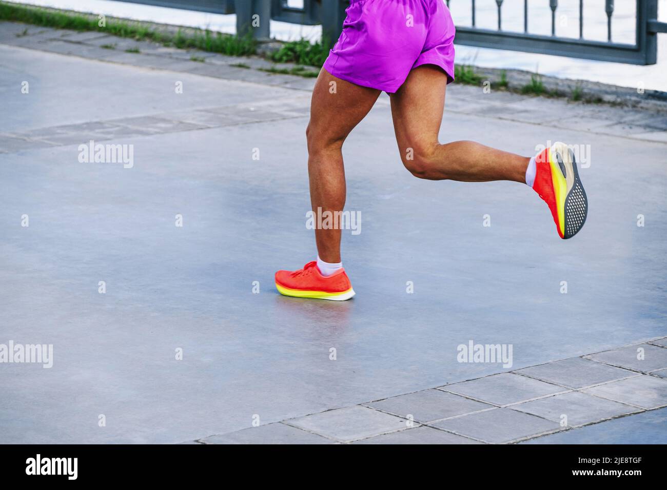 legs female runner run marathon in riverfront Stock Photo - Alamy