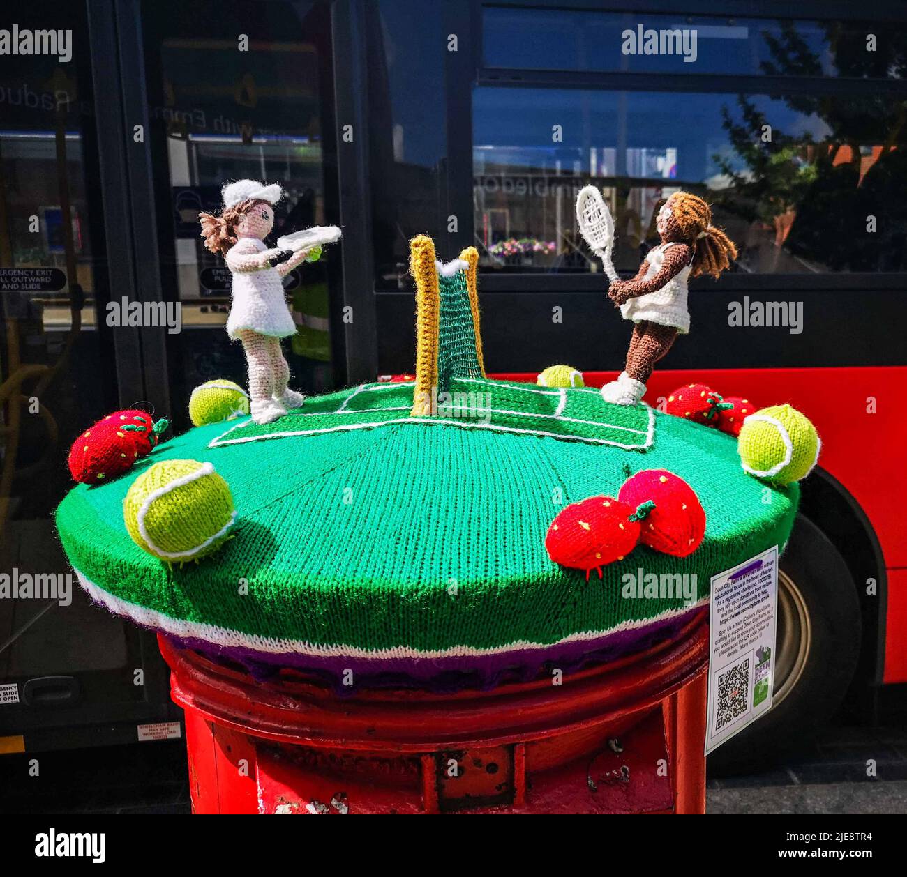Wimbledon ,London,UK 26 June 2022 A Red post box with a knitted ...
