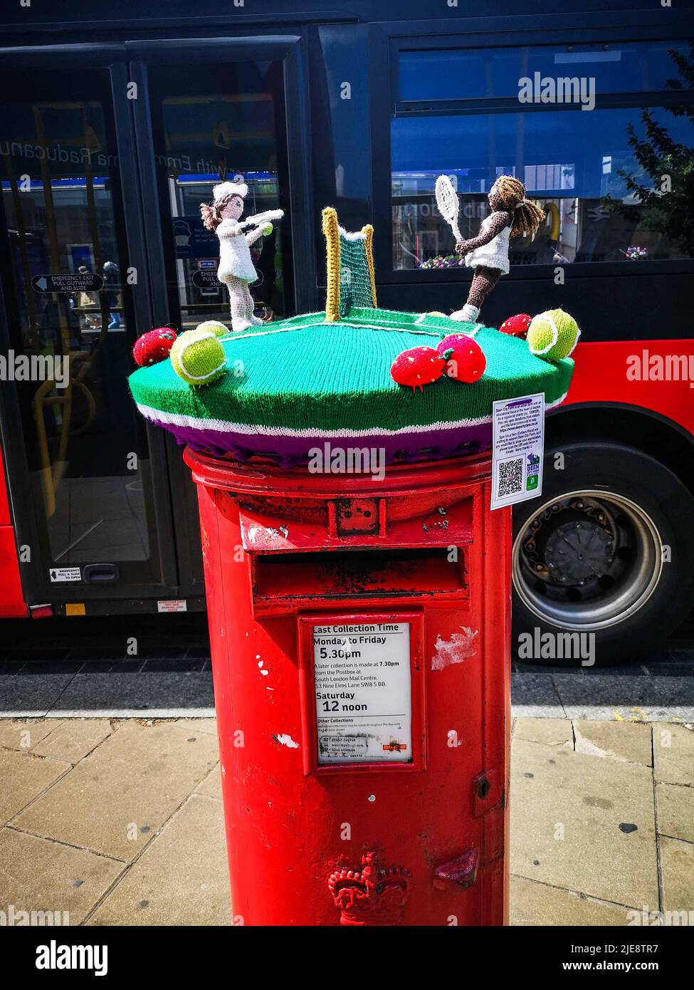 Wimbledon ,London,UK 26 June 2022 A Red post box with a knitted ...