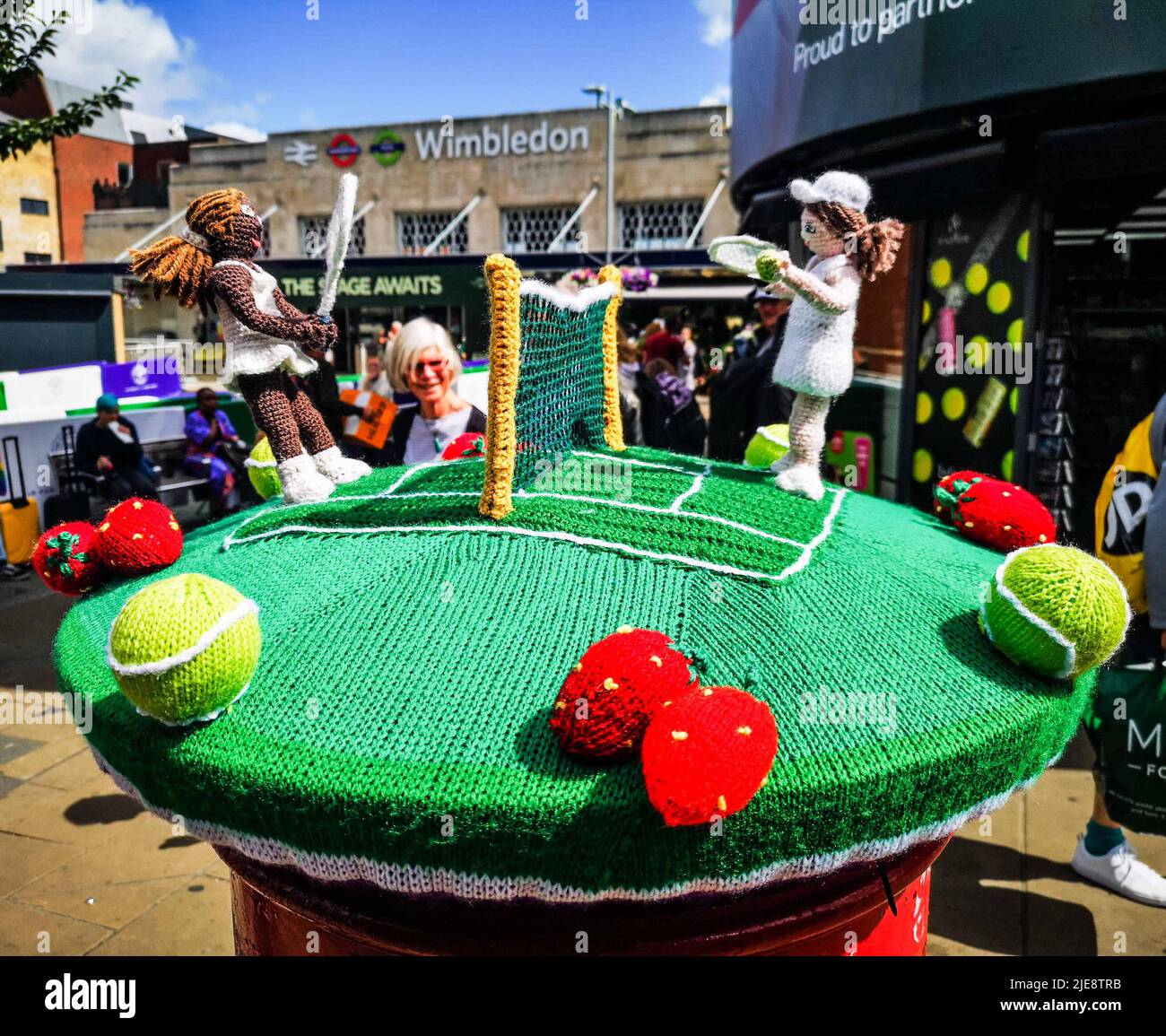 Wimbledon ,London,UK 26 June 2022 A Red post box with a knitted ...