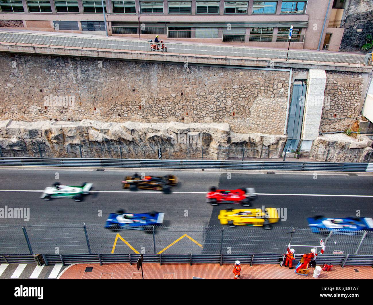 Historic formula one grand prix cars on the Monaco circuit with ra ...