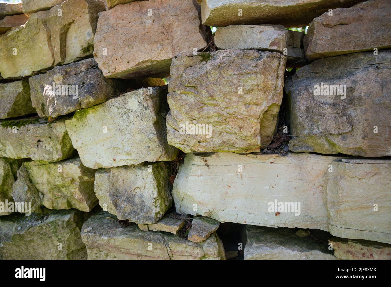 Stack of stones. Stone stack wall in the forest Stock Photo - Alamy