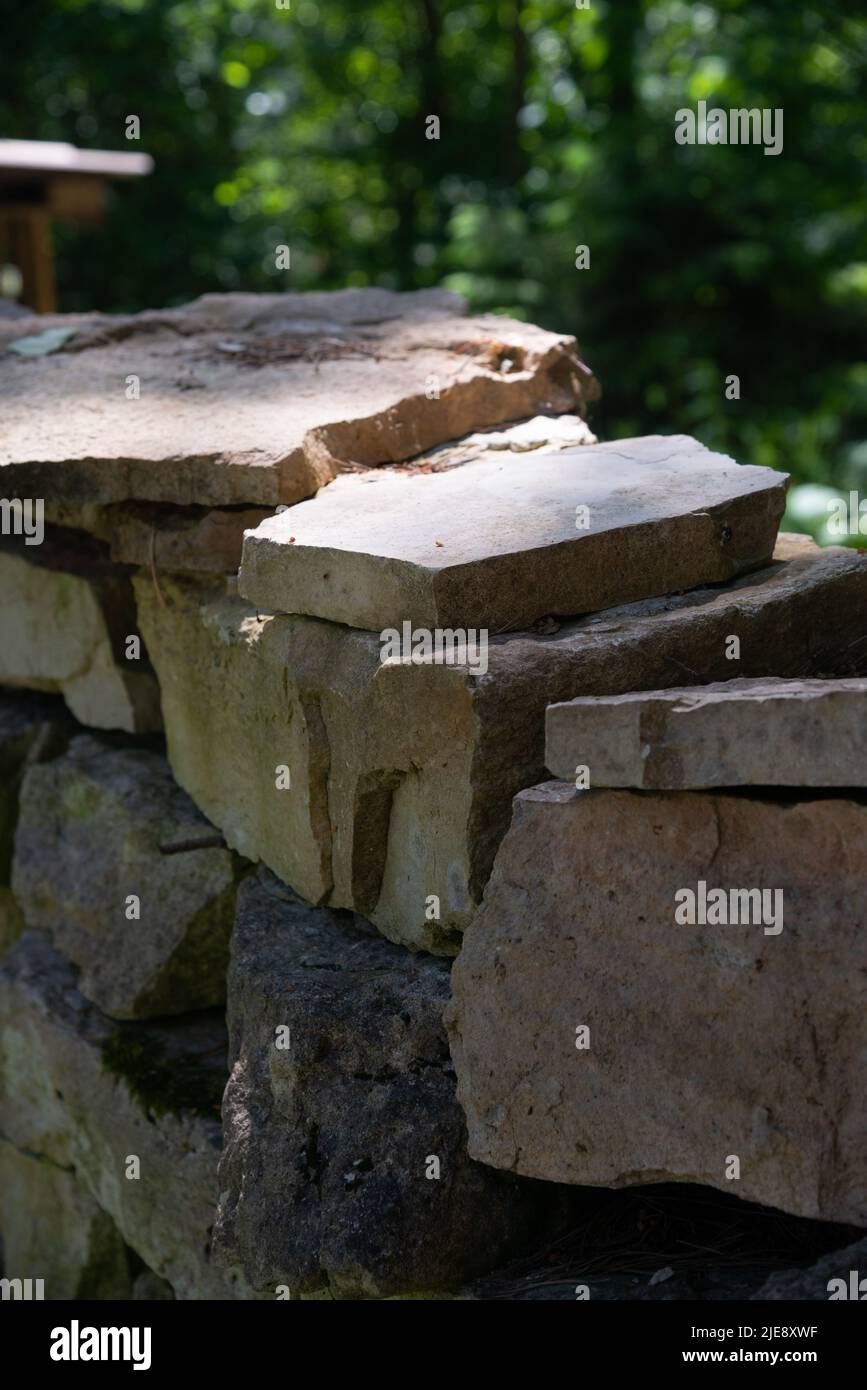 Stack of stones. Stone stack wall in the forest Stock Photo - Alamy