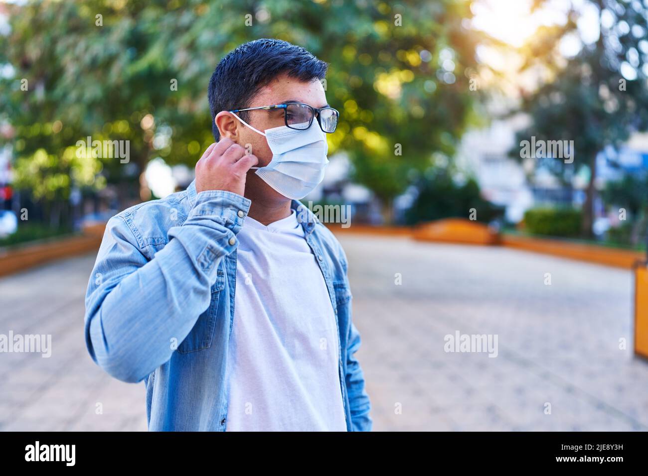 Down syndrome man wearing medical mask at park Stock Photo - Alamy