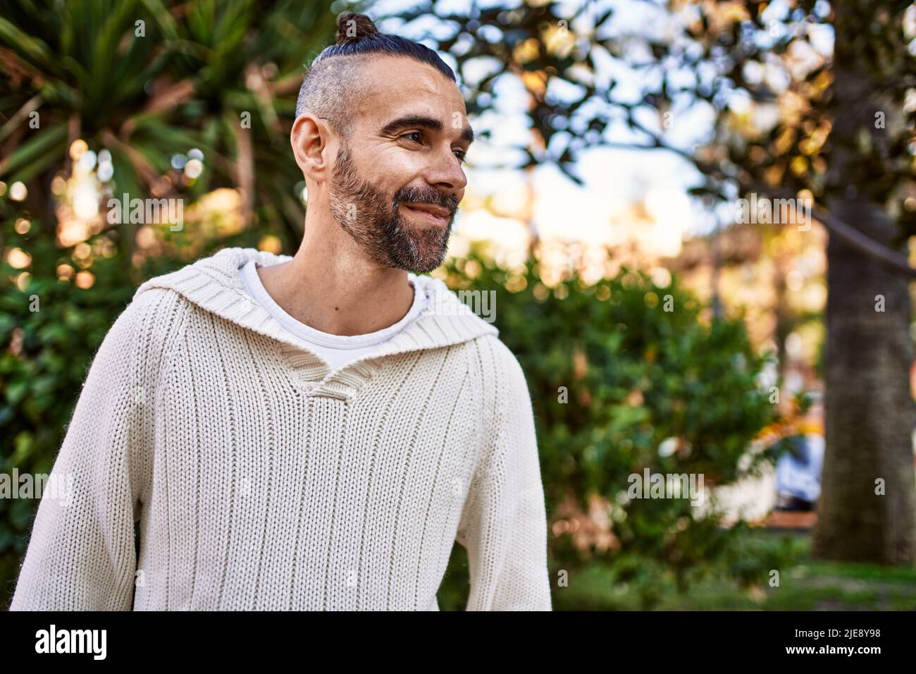 Handsome middle age man with beard standing happy and confident at the ...