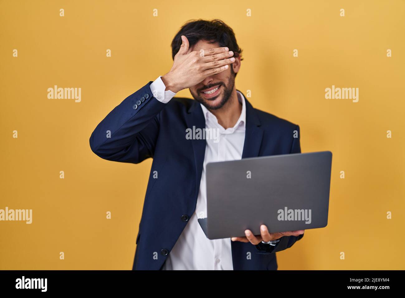 Handsome latin man working using computer laptop smiling and laughing ...