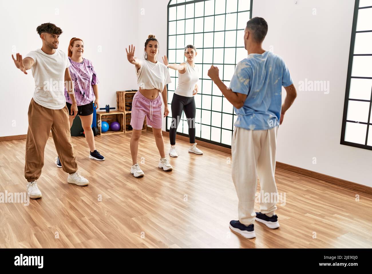 Group of young dancer smiling happy dancing choreography at dance ...