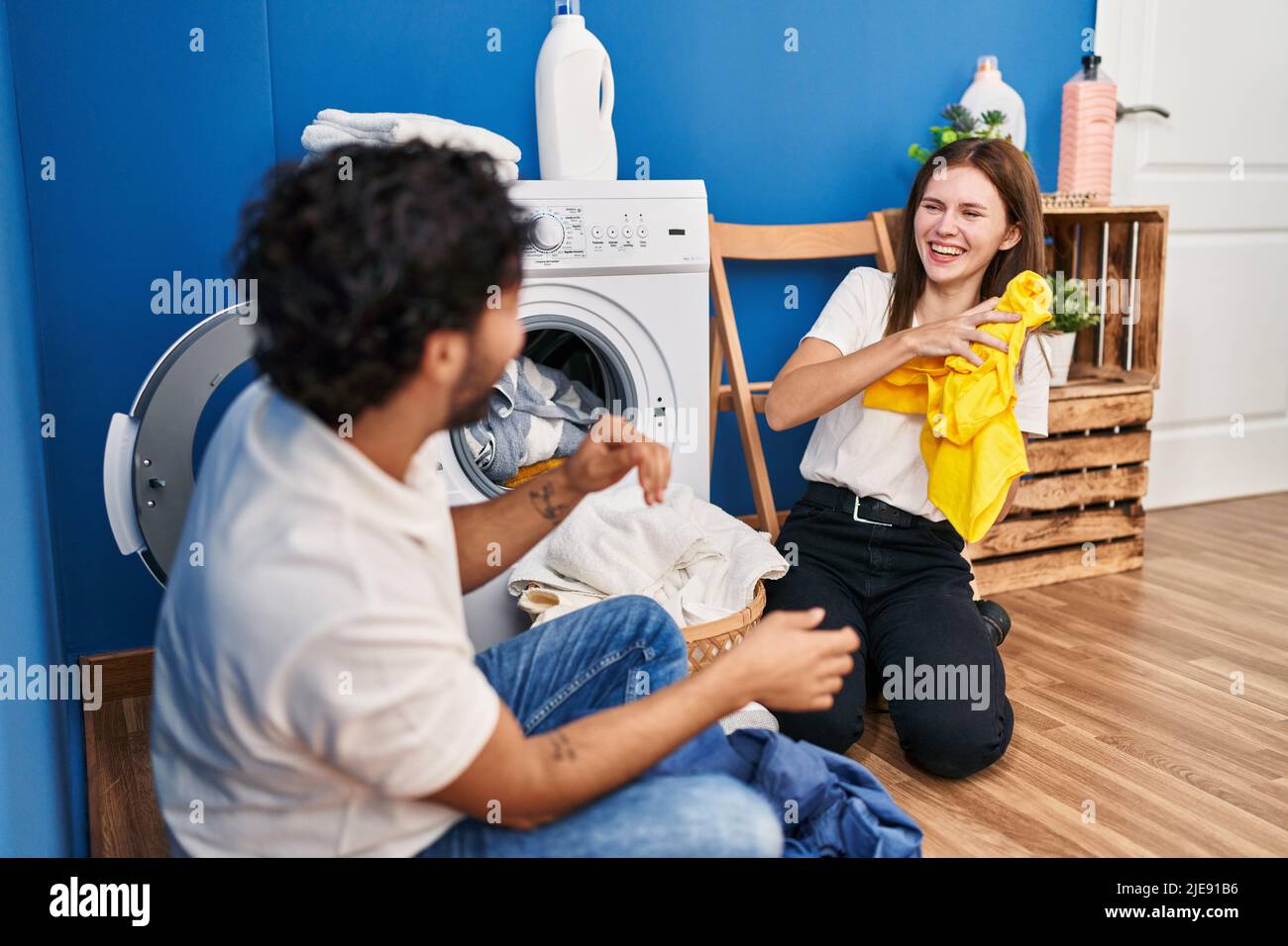 Young woman washing clothes playing hi-res stock photography and images ...