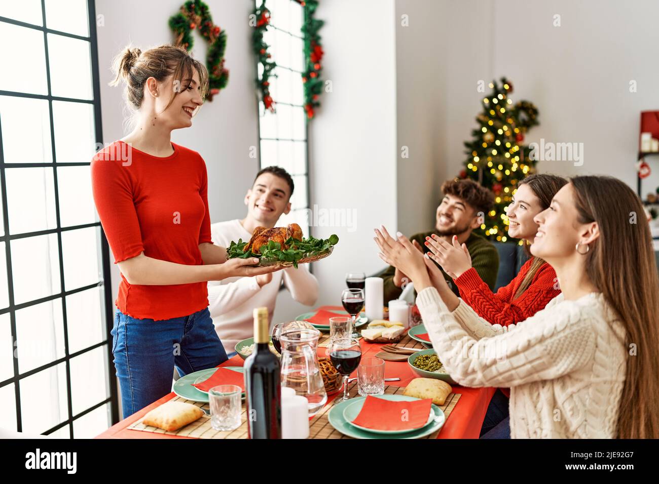 Group of people meeting clapping and sitting on the table. Woman ...