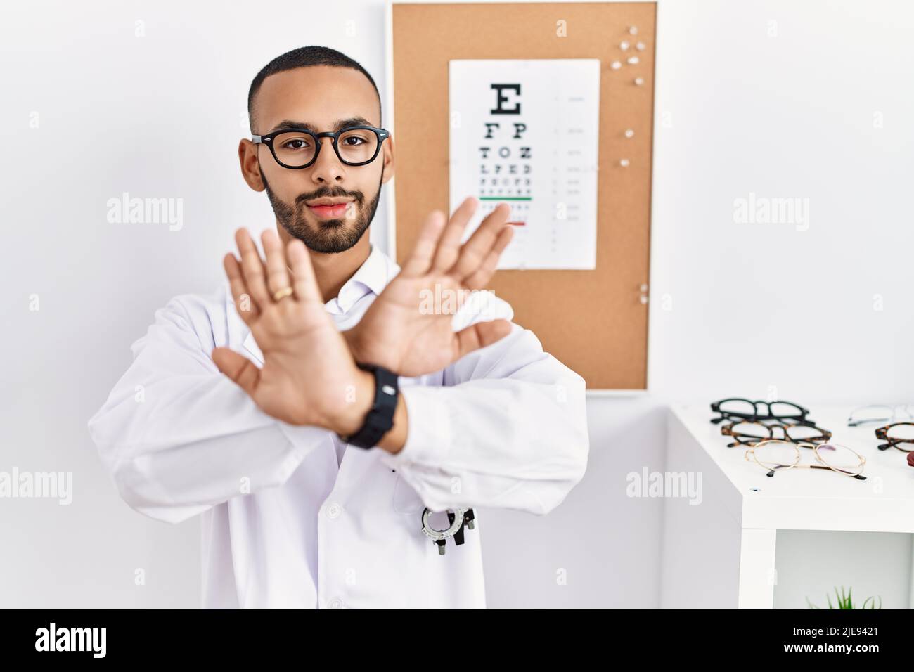 African american optician man standing by eyesight test rejection ...