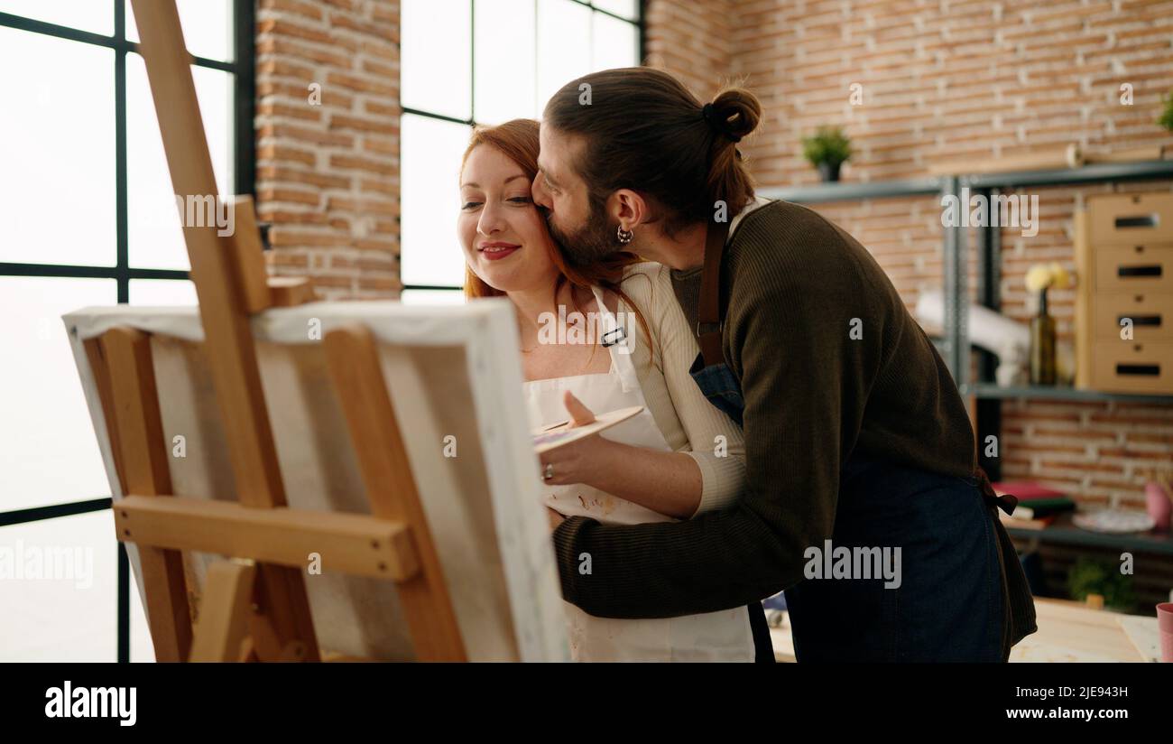 Man and woman couple smiling confident drawing at art studio Stock Photo - Alamy