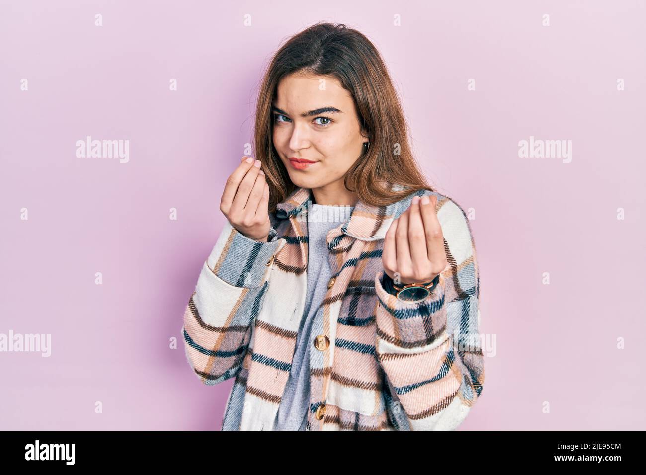 Young Caucasian Girl Wearing Casual Clothes Doing Money Gesture With