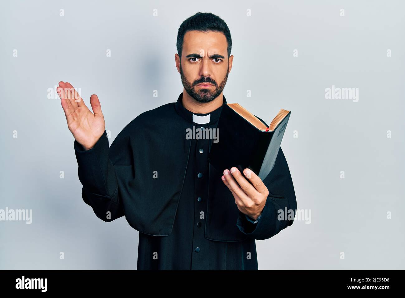 Man holding bible thinking hi-res stock photography and images - Alamy