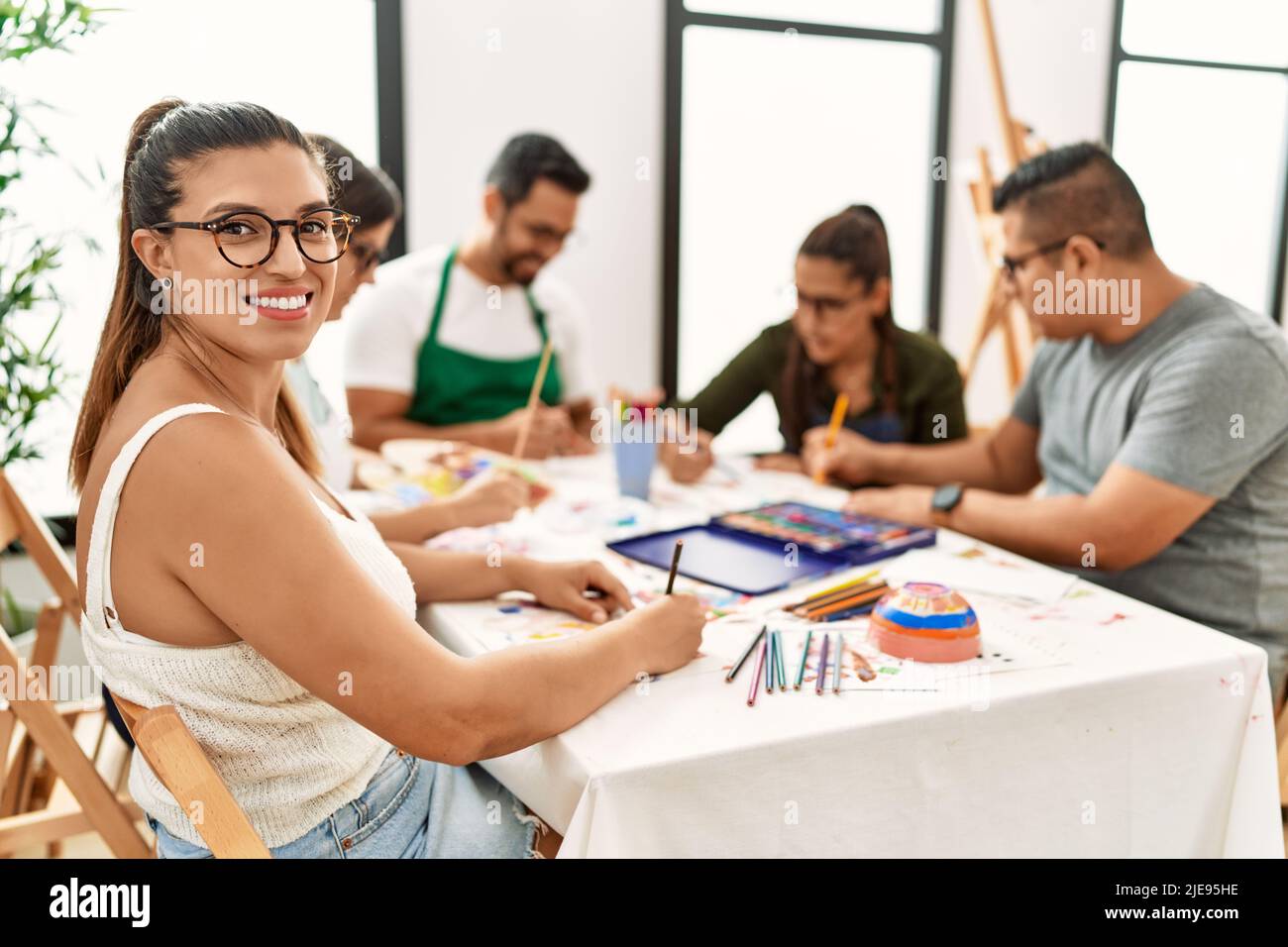 Group of draw students sitting on the table drawing at art studio Stock ...