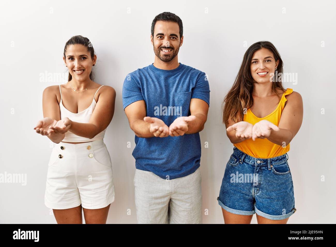 Group of young hispanic people standing over isolated background ...
