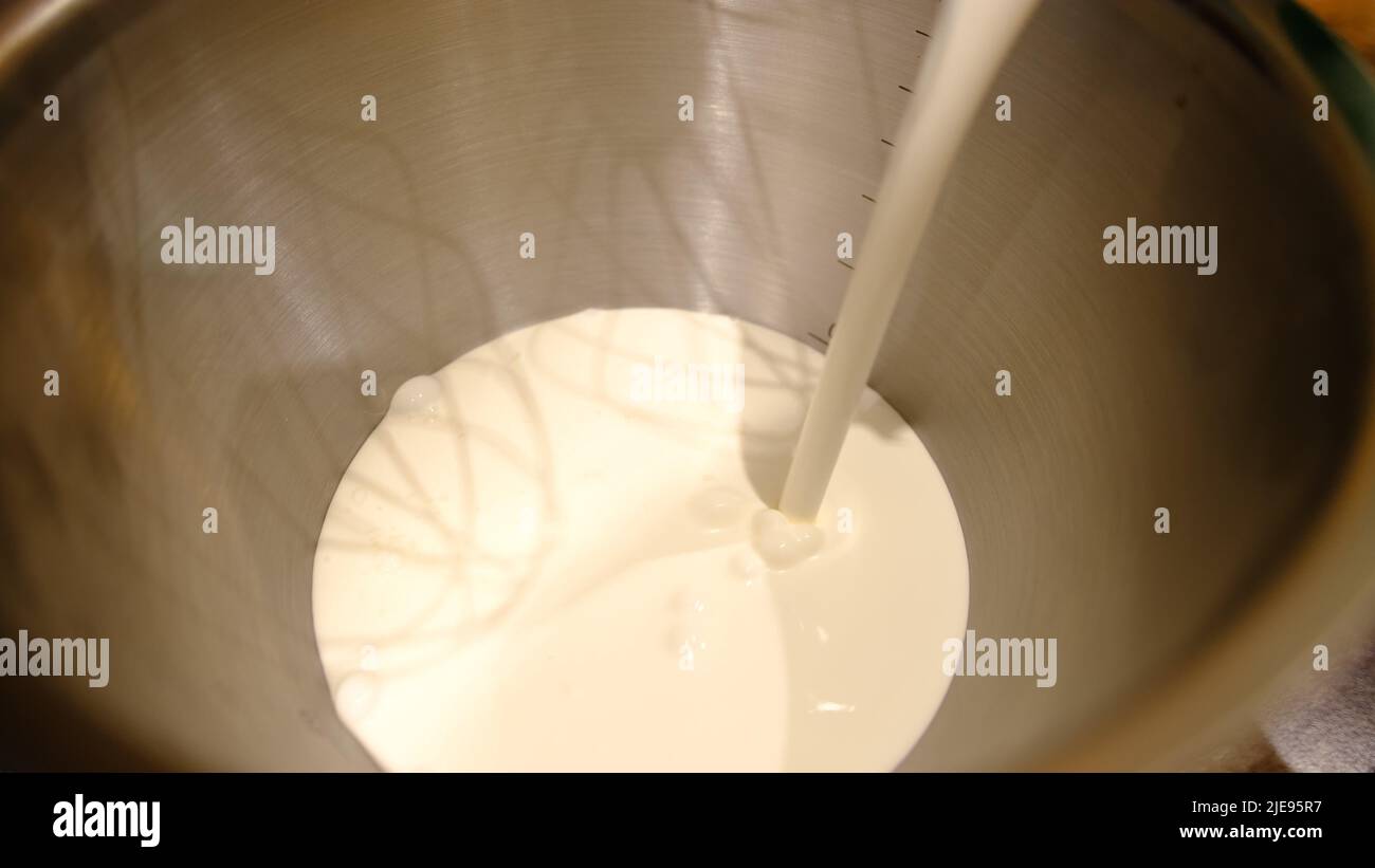 Whipping cream whites in food processor. Hands of professional male ...