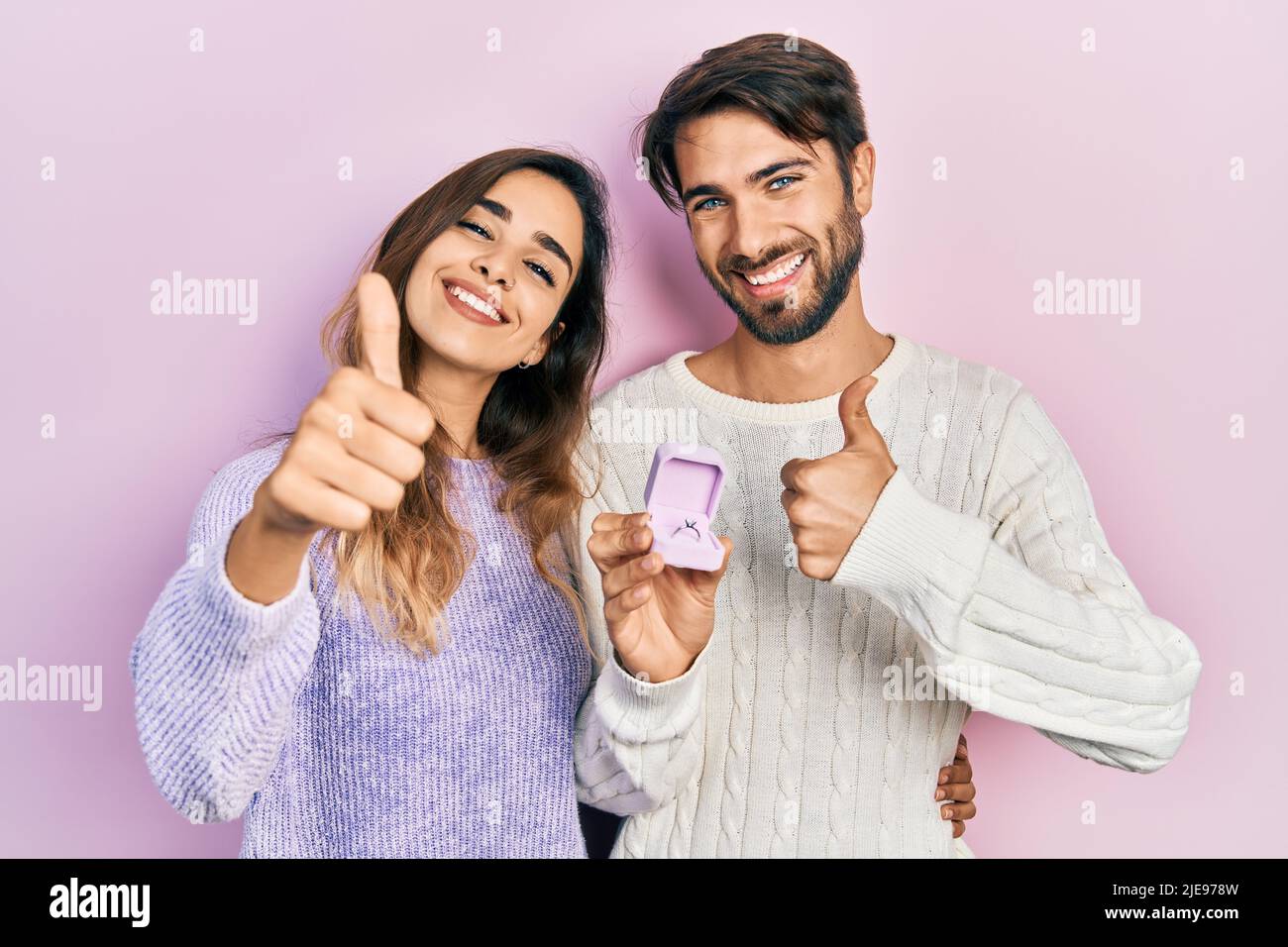 Beautiful couple of boyfriend and girlfriend holding engagement ring ...