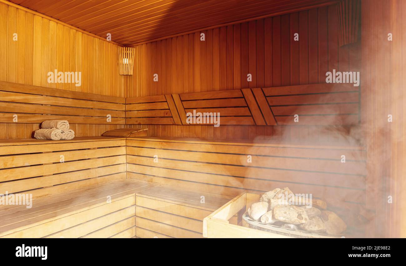 Interior of Finnish sauna, classic wooden sauna with hot steam. Russian ...